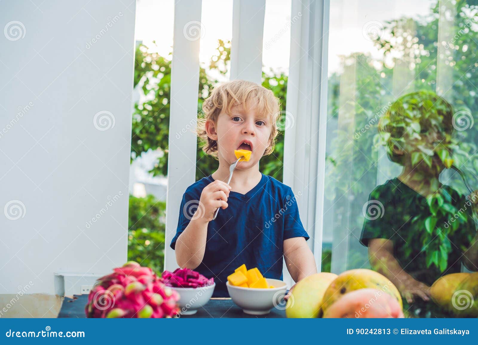 Little Cute Boy Eating Mango on the Terrace Stock Image - Image of ...