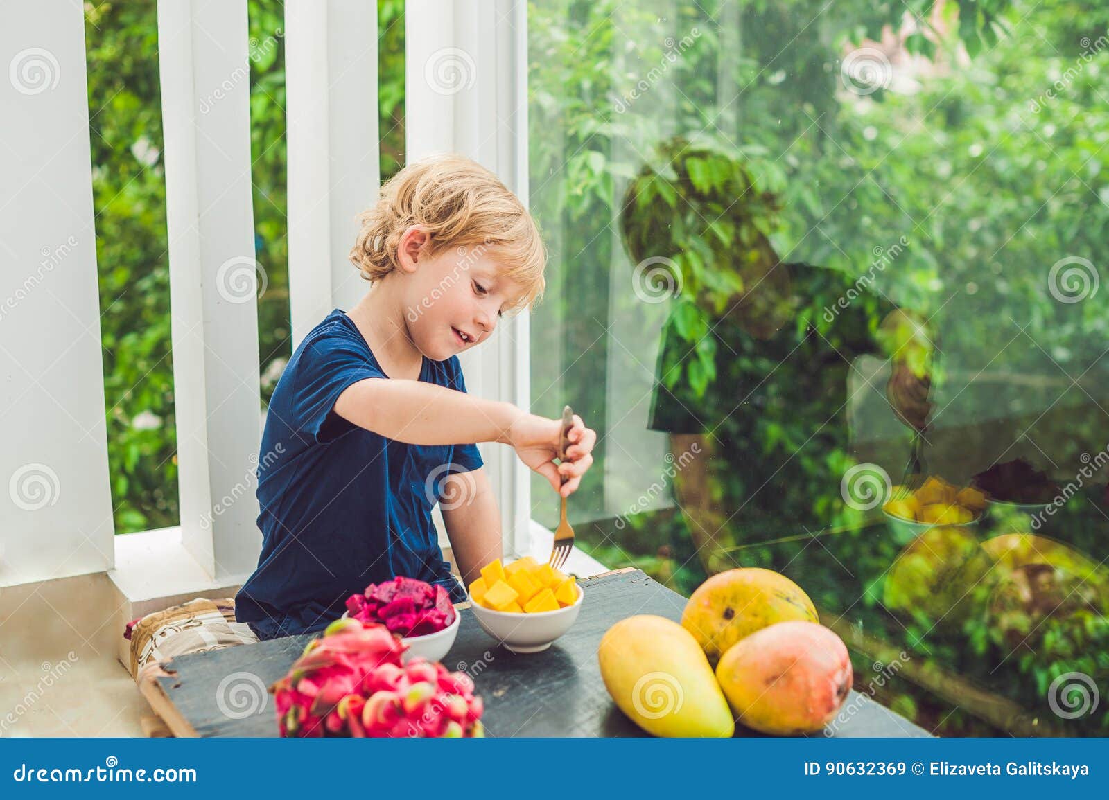 Little Cute Boy Eating Mango on the Terrace Stock Image - Image of ...
