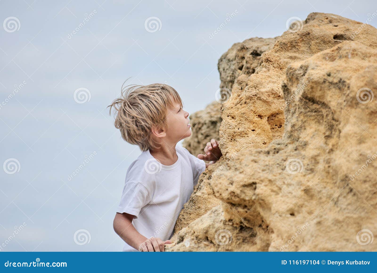Boy playing with rocks stock photo. Image of mountaineering - 116197104
