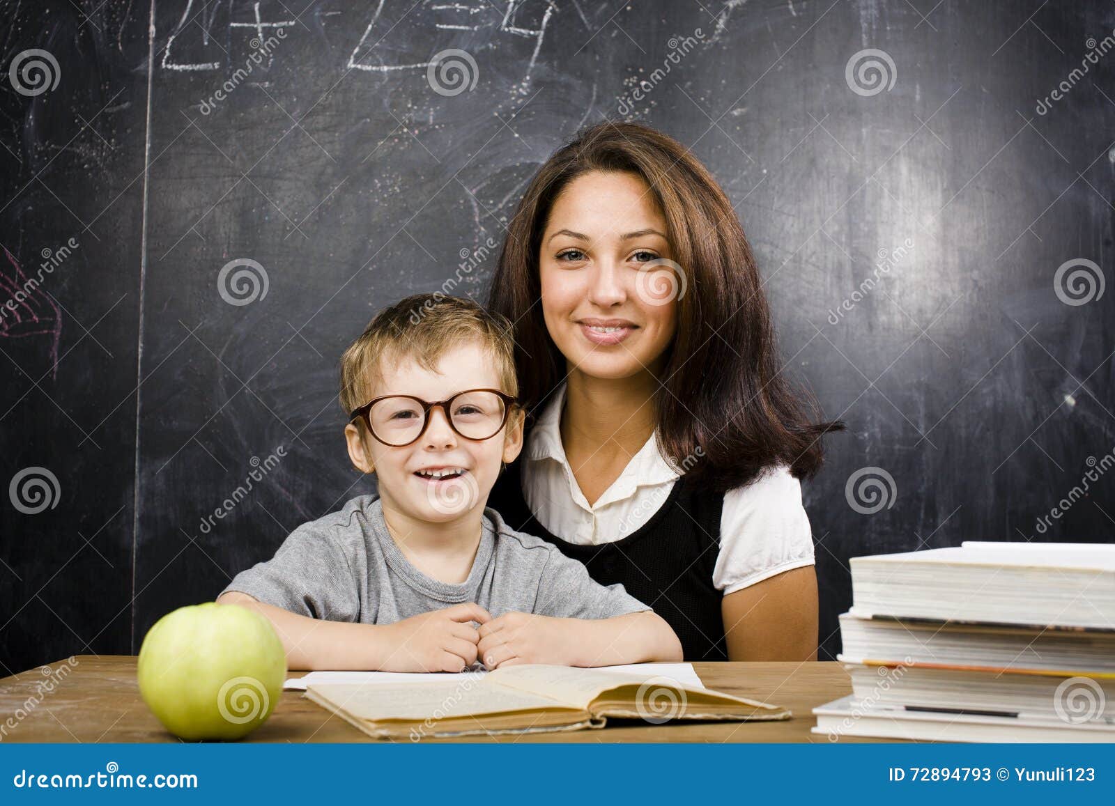 Little Cute Boy with Young Teacher in Classroom Studying at Blackboard ...