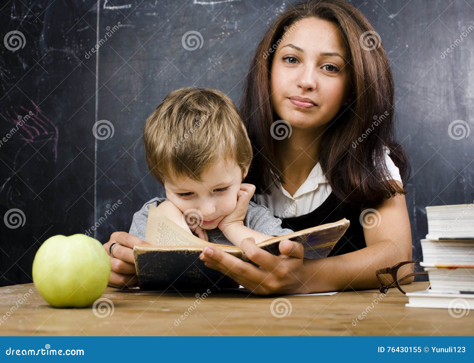 Little Cute Boy with Young Teacher in Classroom Studying at Blackboard ...