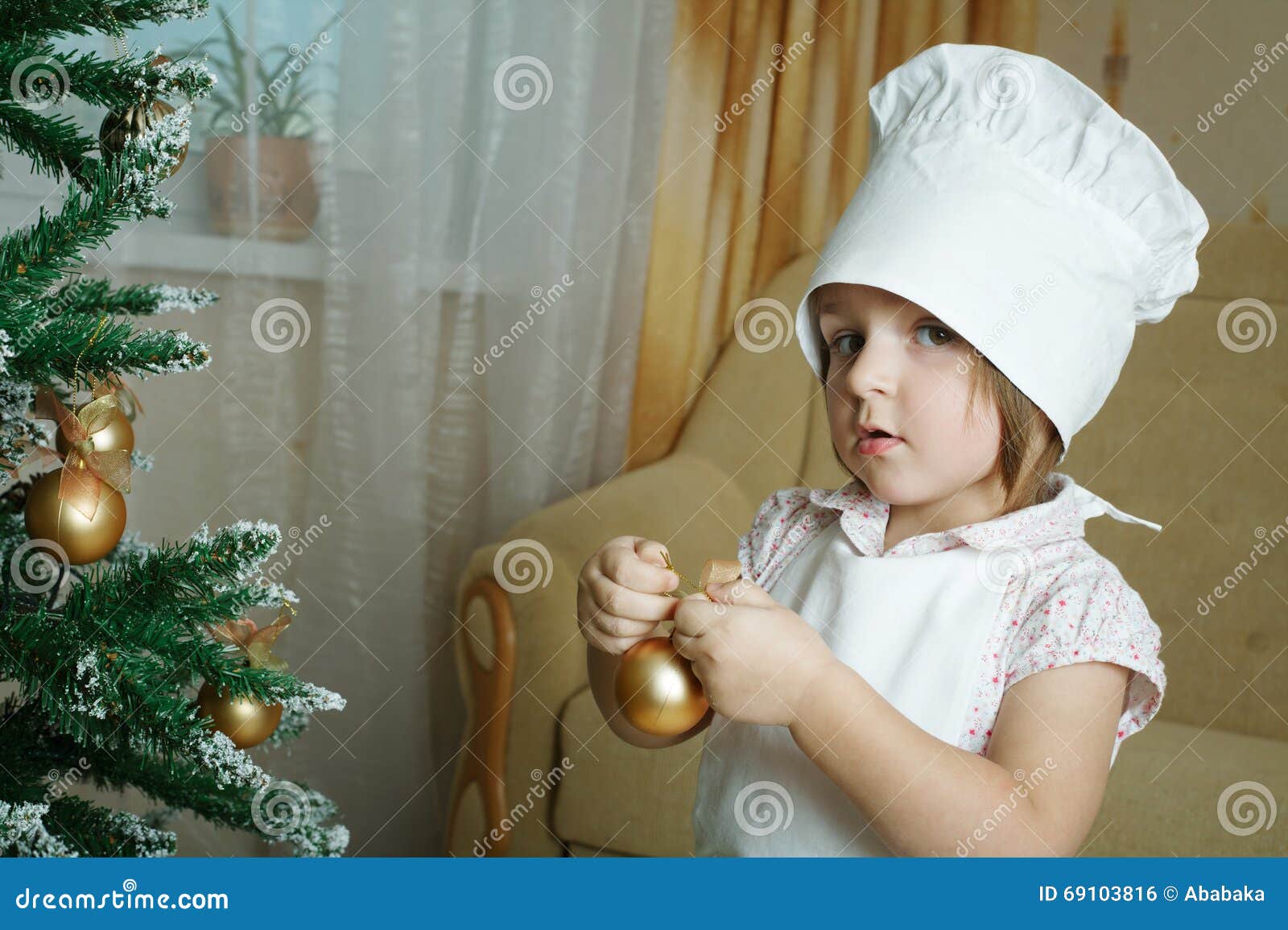 Little Cute Chef Decorating Christmas Tree Stock Photo - Image of ...