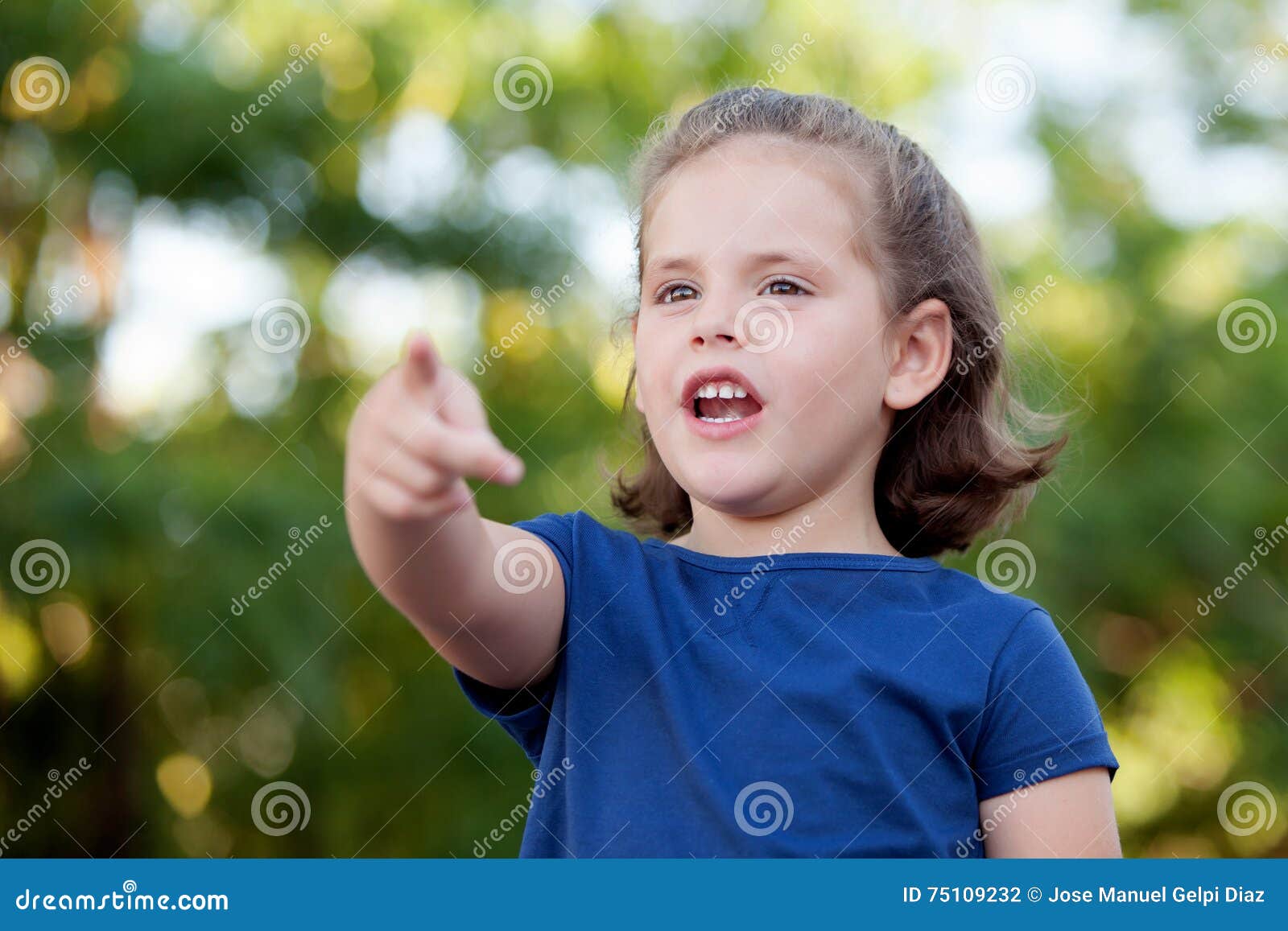 Little Cute Girl Indicating the Direction Stock Photo - Image of ...