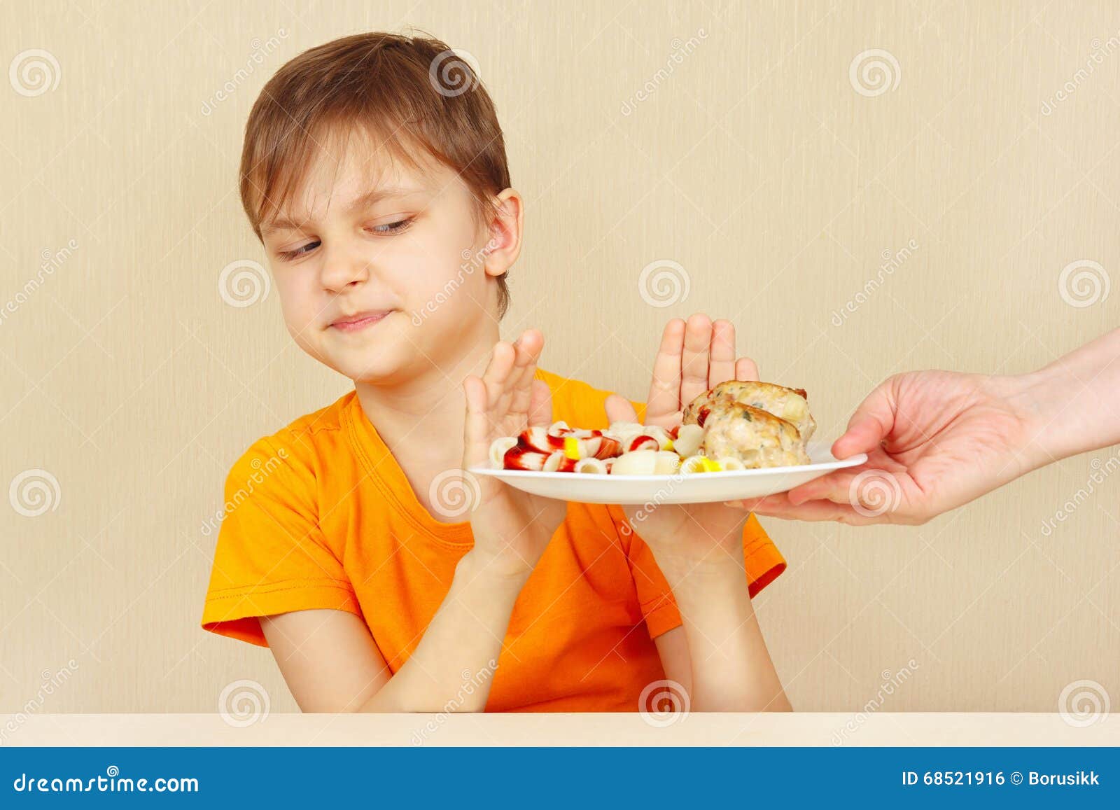 Little Disaffected Boy Refuses To Eat Pasta with Cutlet Stock Photo ...