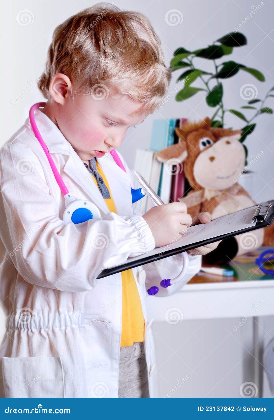 Little Doctor with Clip Board Stock Photo - Image of looking, intern ...