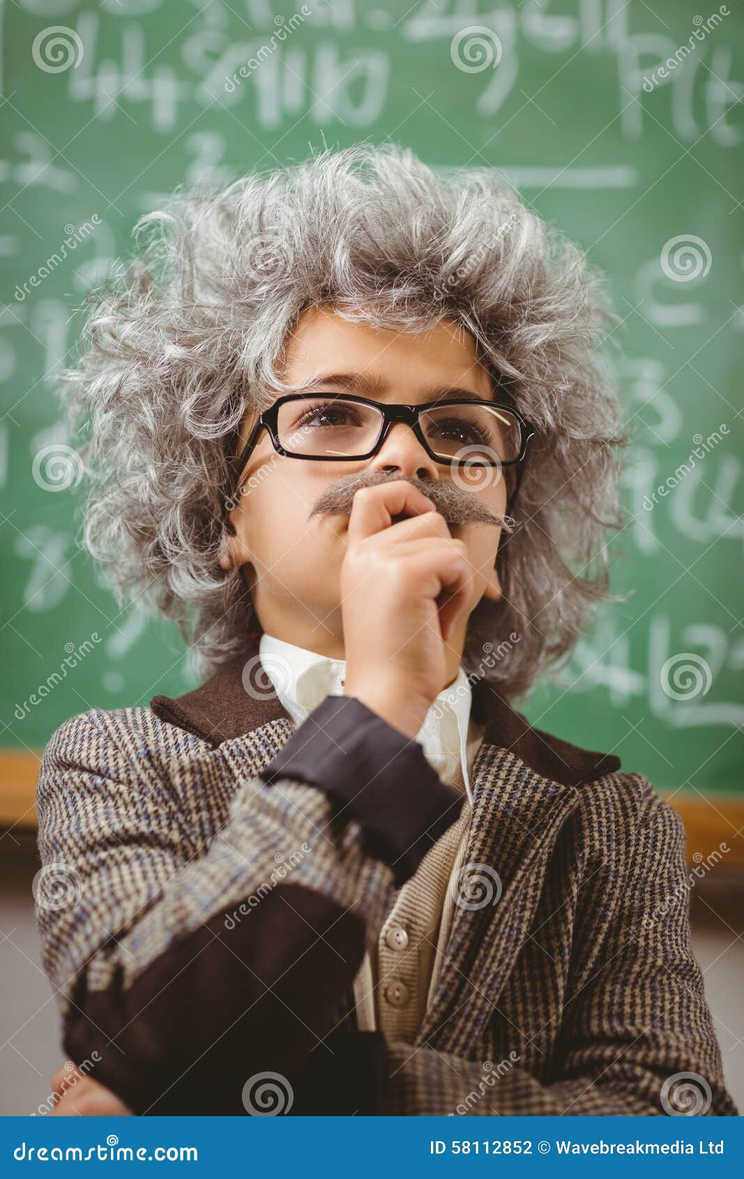 Little Einstein Thinking in Front of Chalkboard in a Classroom Stock ...