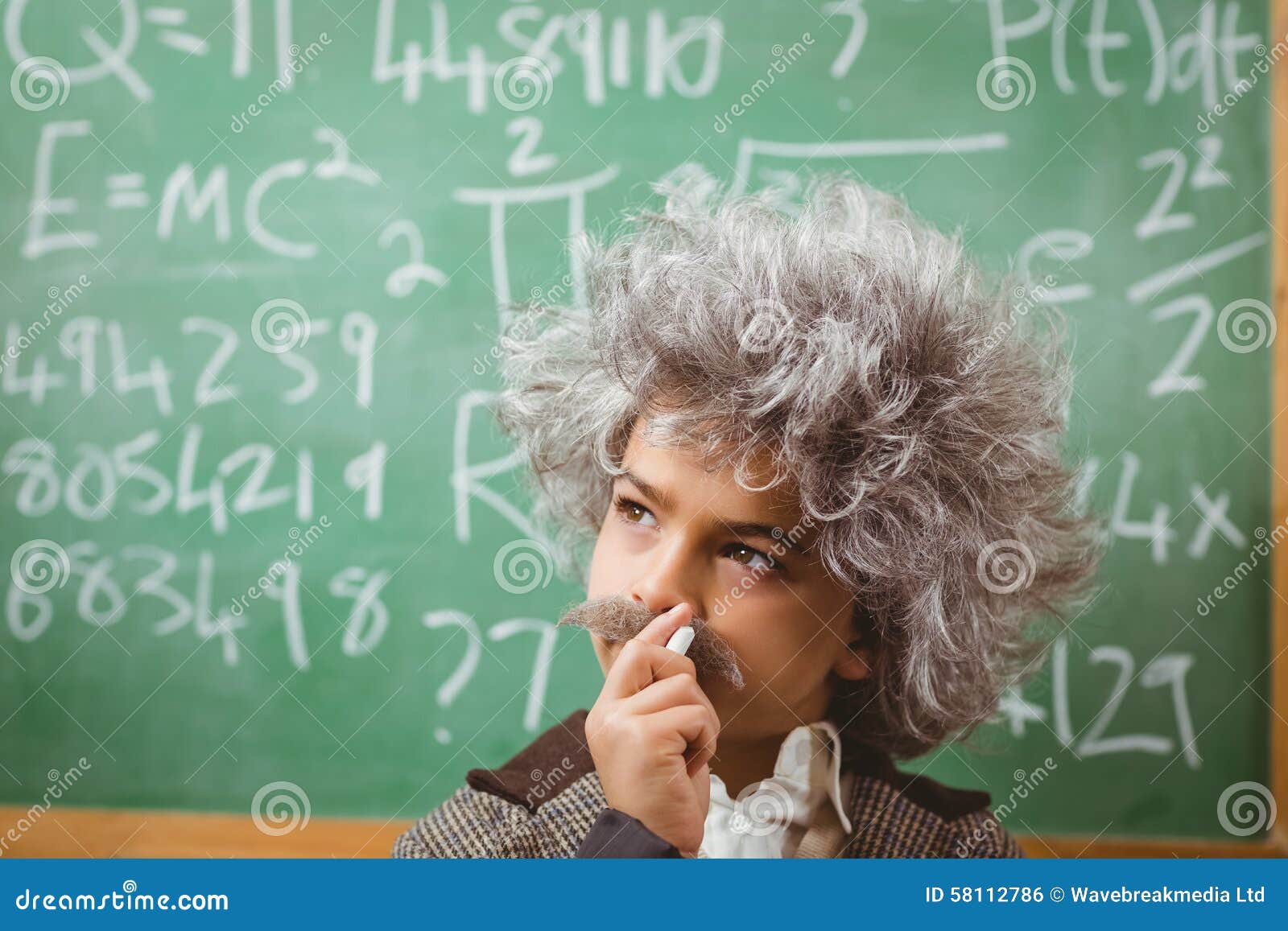 Little Einstein Thinking in Front of Chalkboard Stock Photo - Image of ...