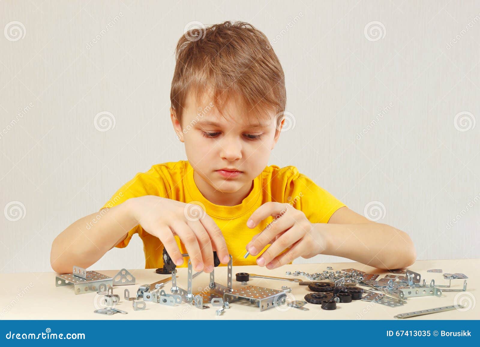 Little Engineer Plays with Mechanical Constructor at Table Stock Image ...