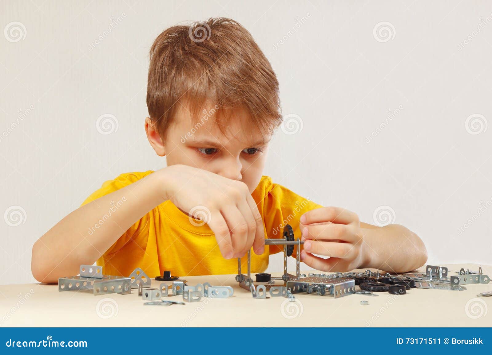 Little Engineer Plays with Mechanical Kit at Table Stock Image - Image ...