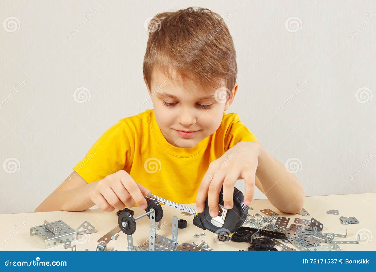 Little Engineer Plays with Metal Constructor at Table Stock Image ...