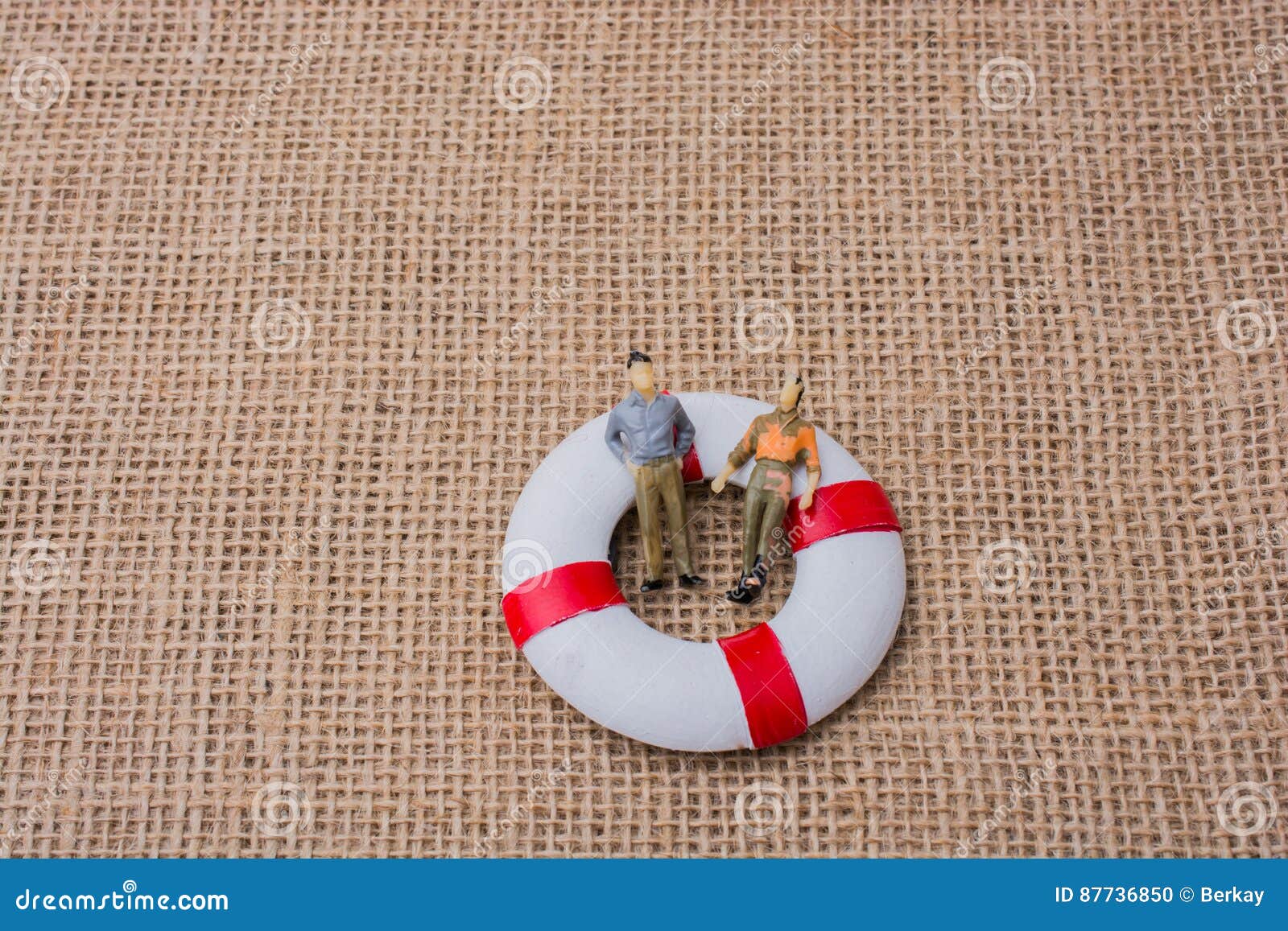 Little Figurine Men in a Life Preserver Stock Photo - Image of ...
