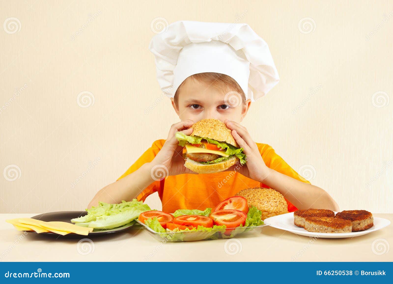 Little Funny Chef is Tasting Cooked Hamburger Stock Photo - Image of ...