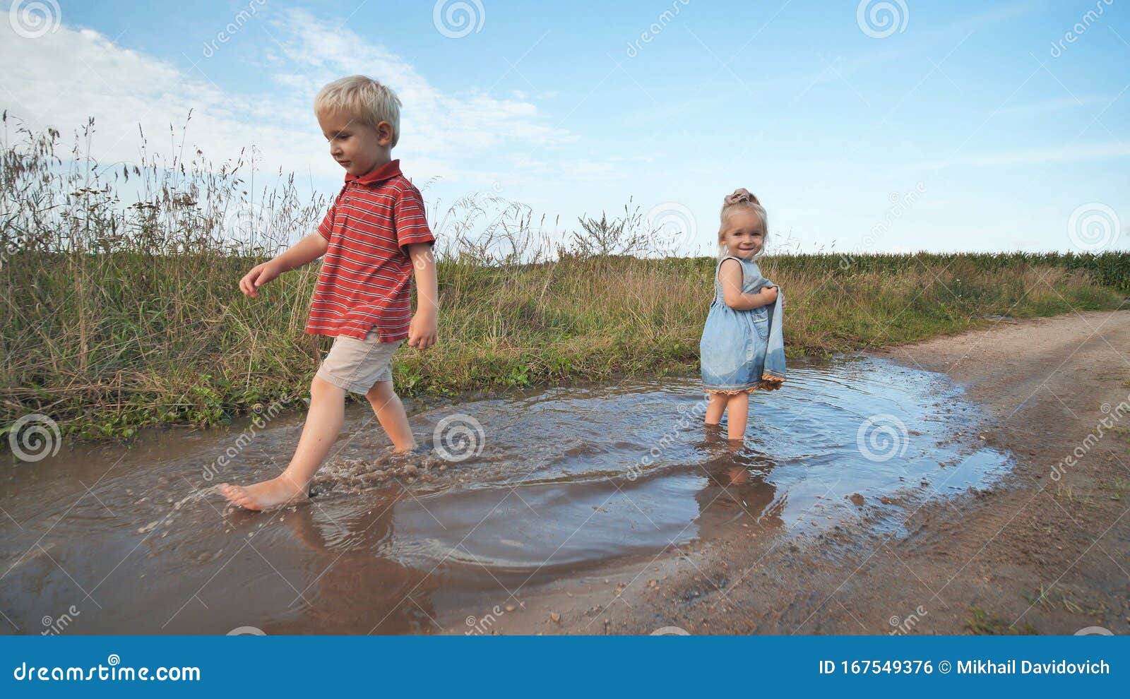 Little Funny Children Run through the Puddles. Stock Photo - Image of ...