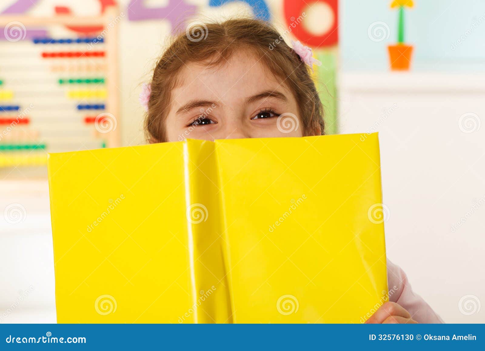 Little genius with book stock photo. Image of brunette - 32576130