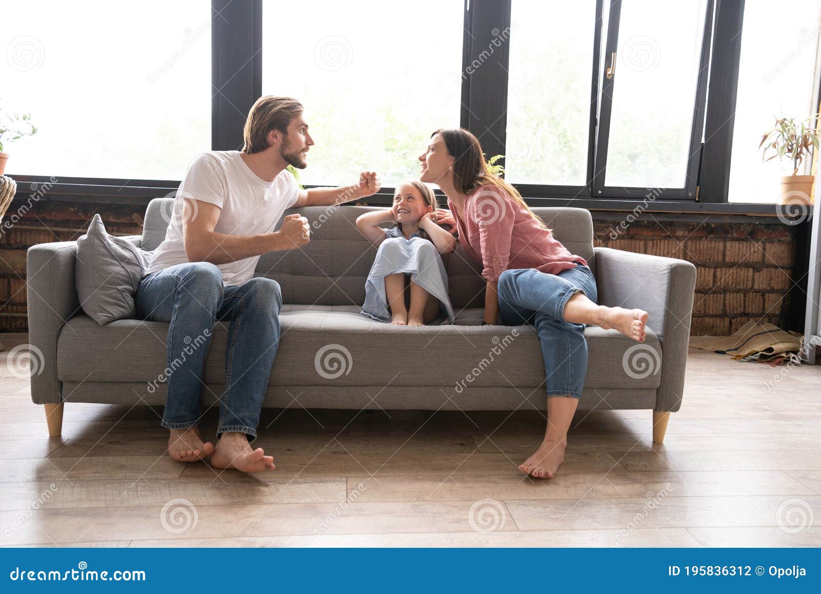 Little Girl between Arguing Parents at Home. Stock Photo - Image of ...