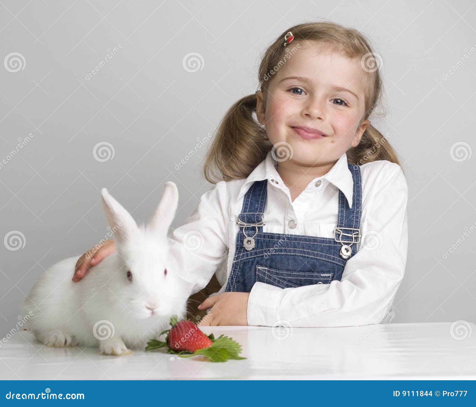 Little Girl and Baby Rabbit Stock Photo - Image of berry, albino: 9111844