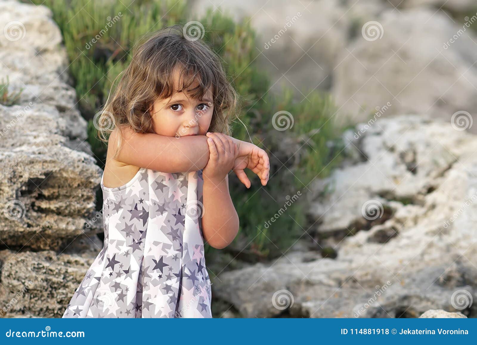 Little Girl on the Background of Mediterranean Rocks Stock Photo ...
