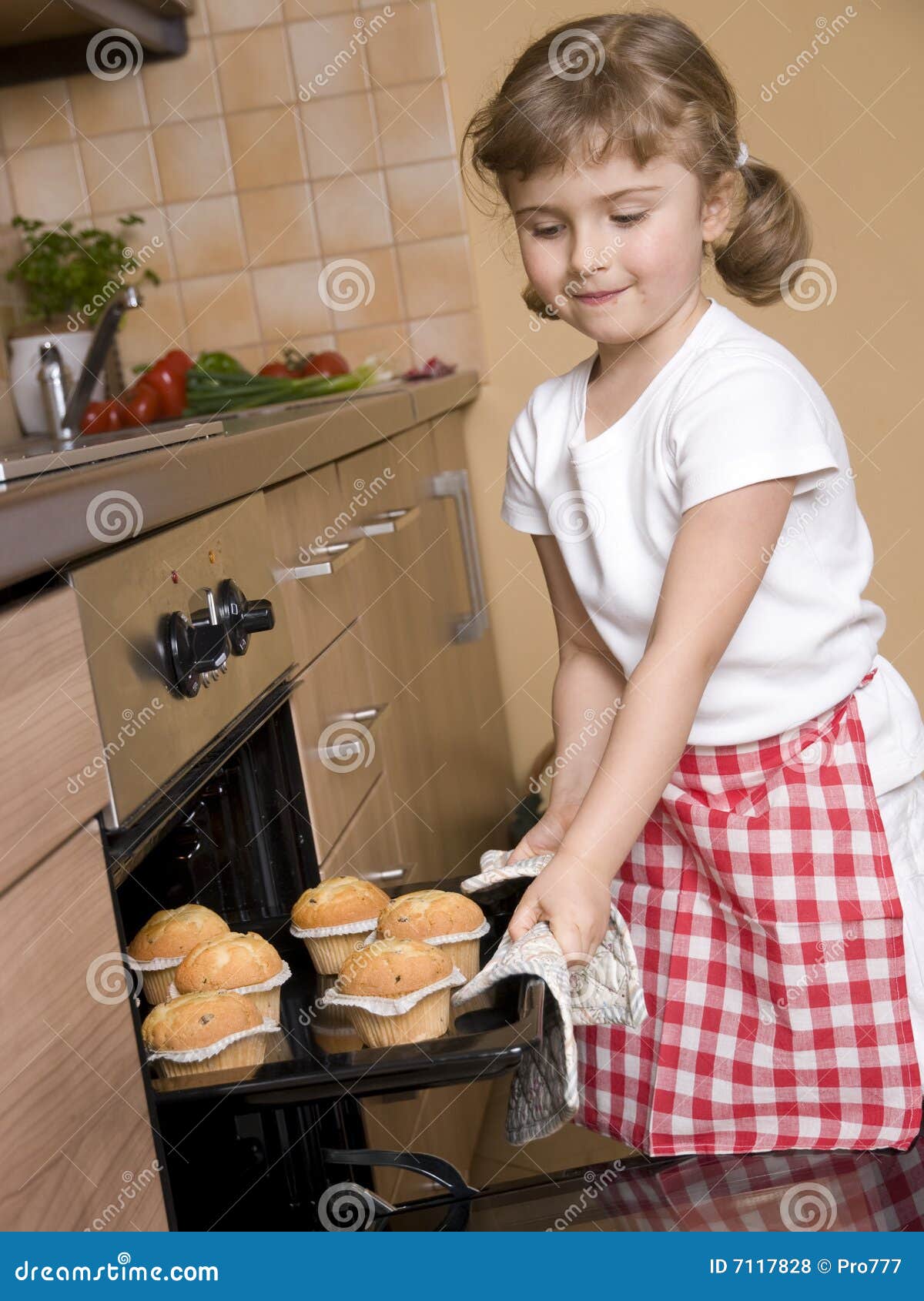 Little girl baking muffins stock photo. Image of domestic - 7117828