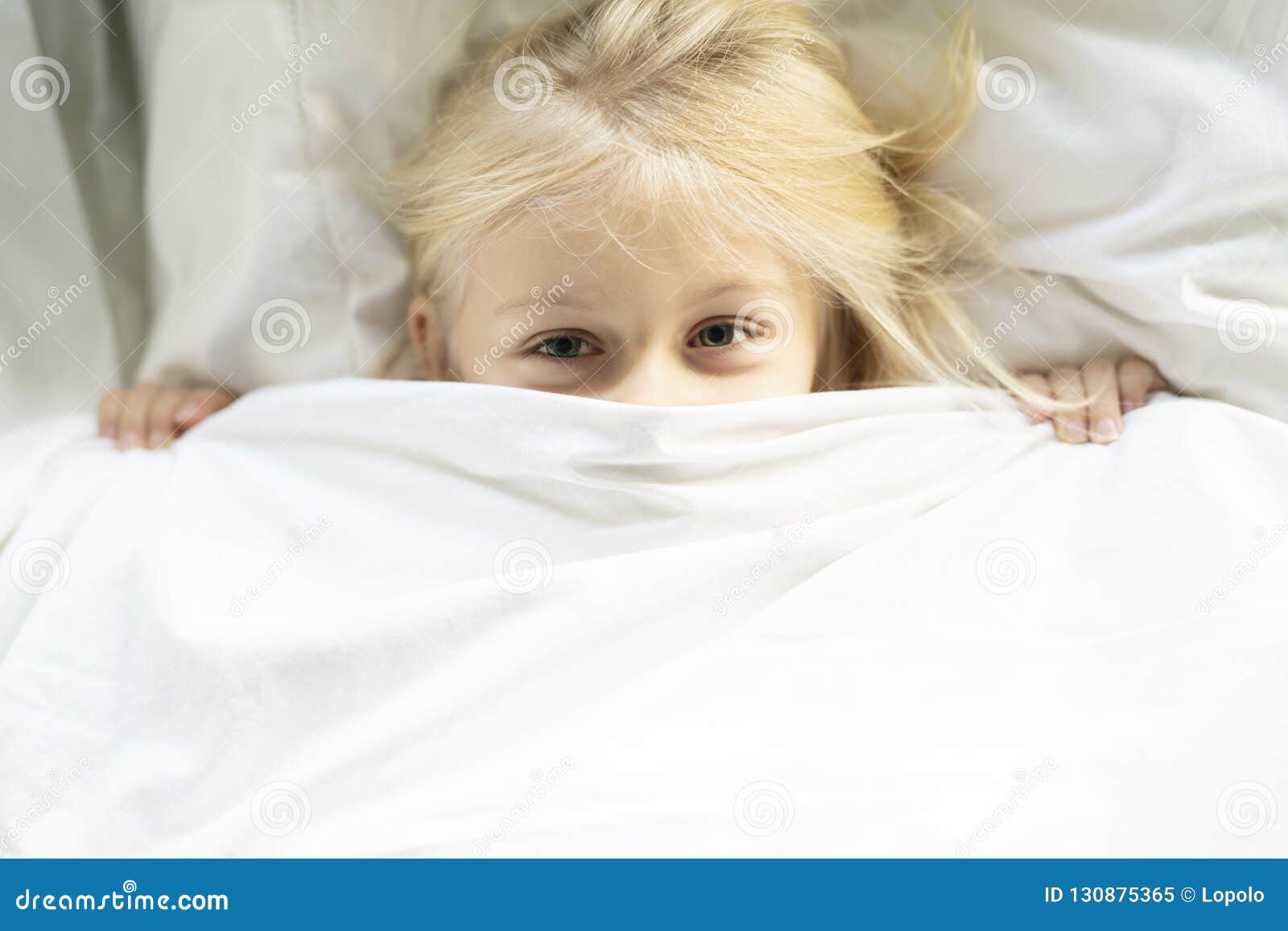 A Little Girl in Bed Below the Covers Stock Image - Image of hair ...