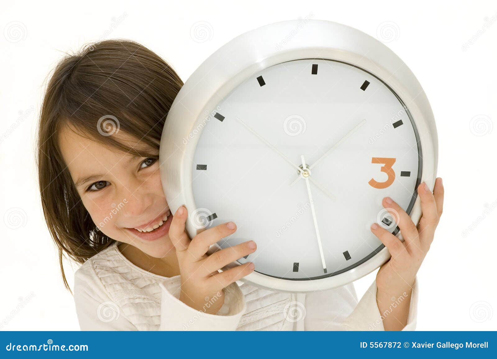 Little girl behind a clock stock photo. Image of date - 5567872