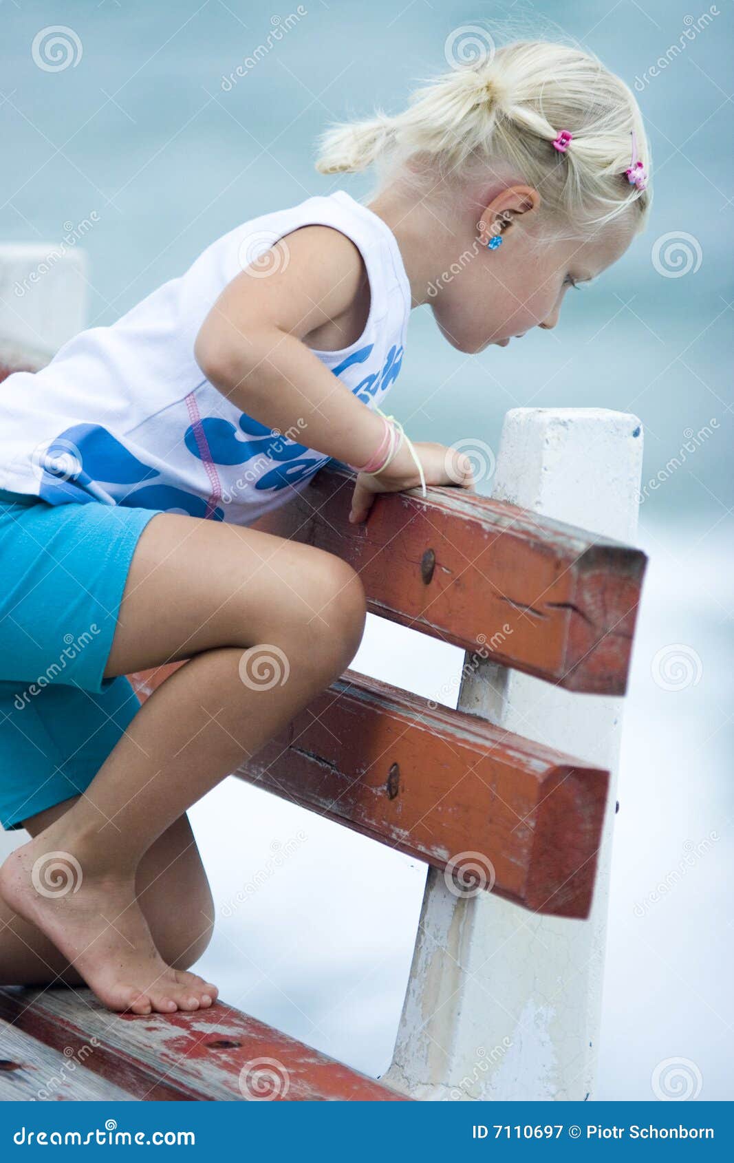 Little girl on a bench stock image. Image of natural, sunny - 7110697