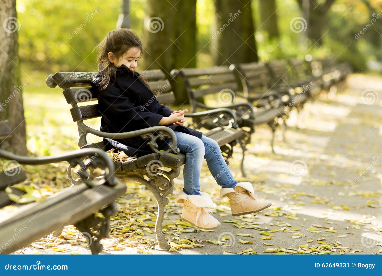 Little girl on the bench stock image. Image of bench - 62649331
