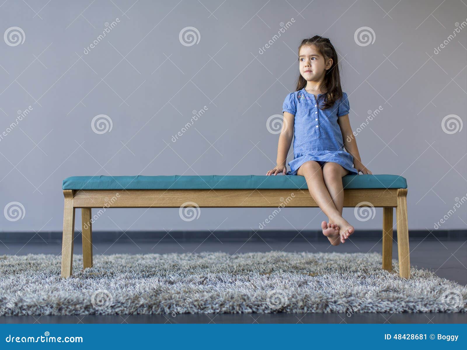 Little girl on the bench stock image. Image of person - 48428681