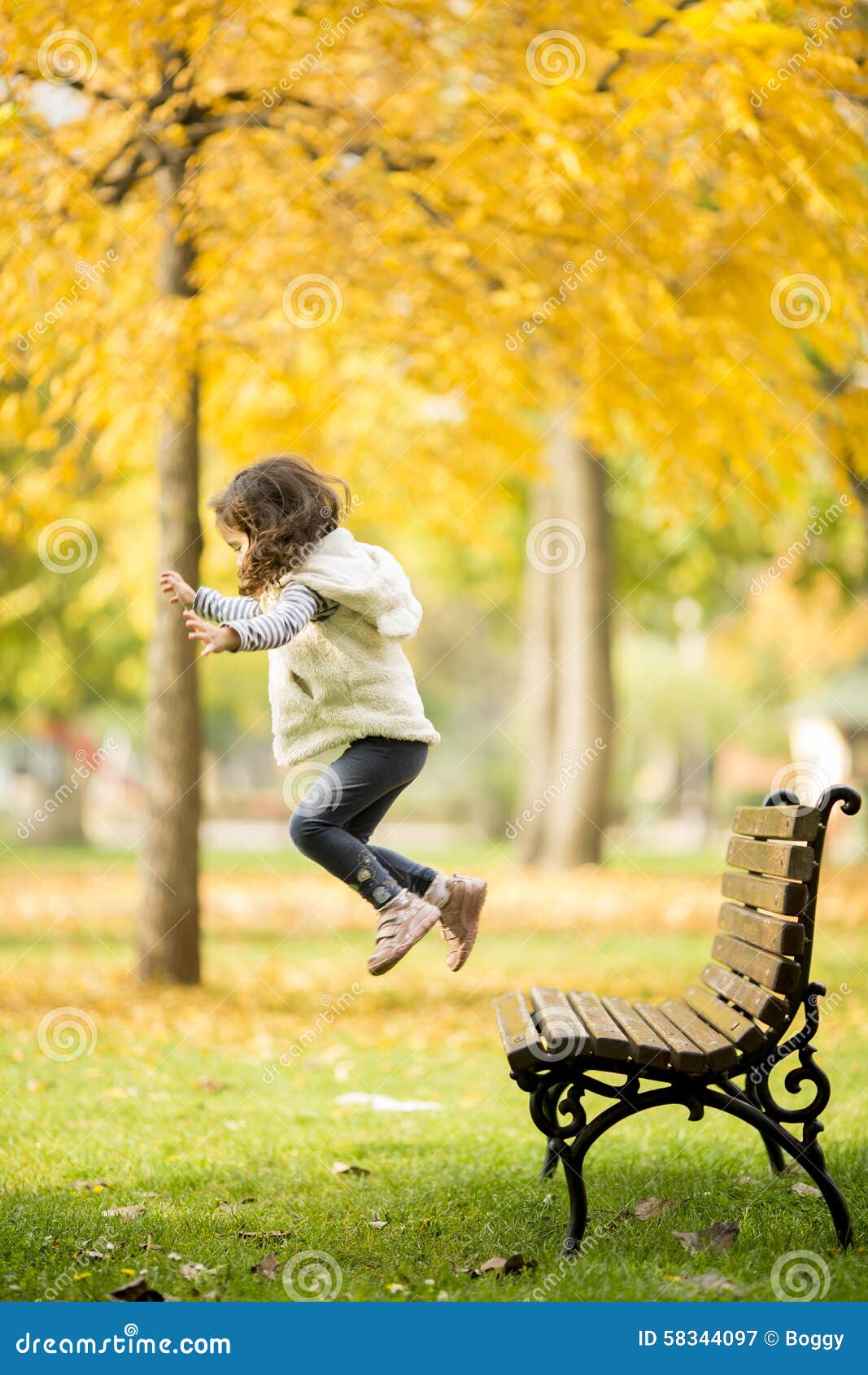 Little girl at the bench stock image. Image of action - 58344097