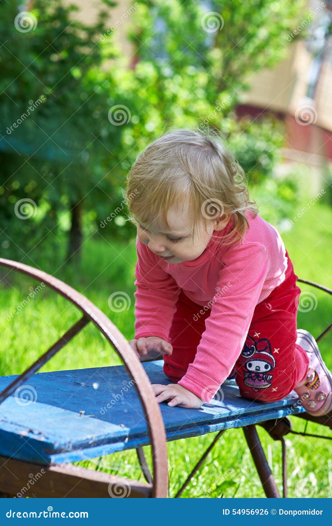 Little Girl on the Bench in Park Stock Photo - Image of jeans, girl ...