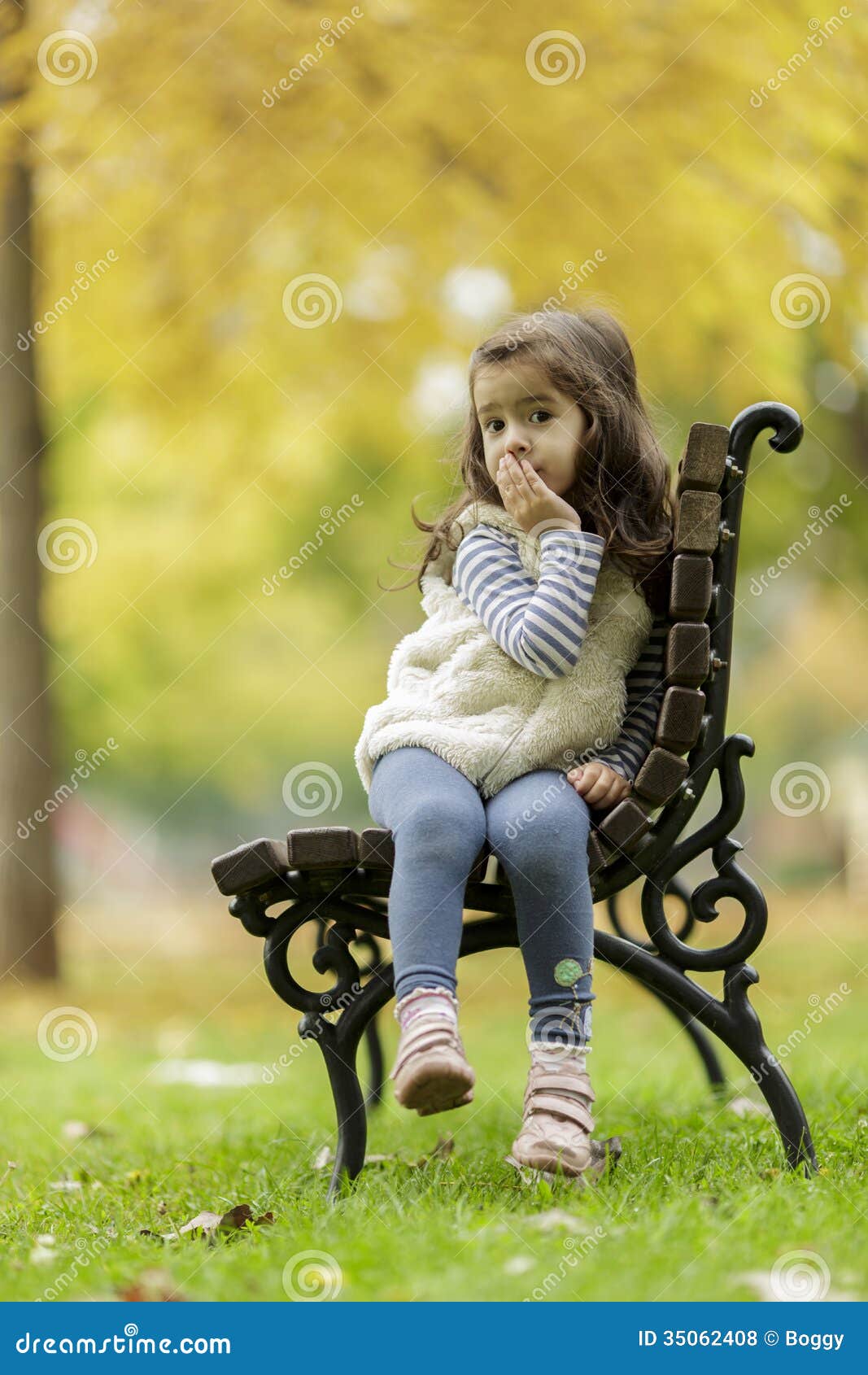 Little girl at the bench stock photo. Image of innocence - 35062408
