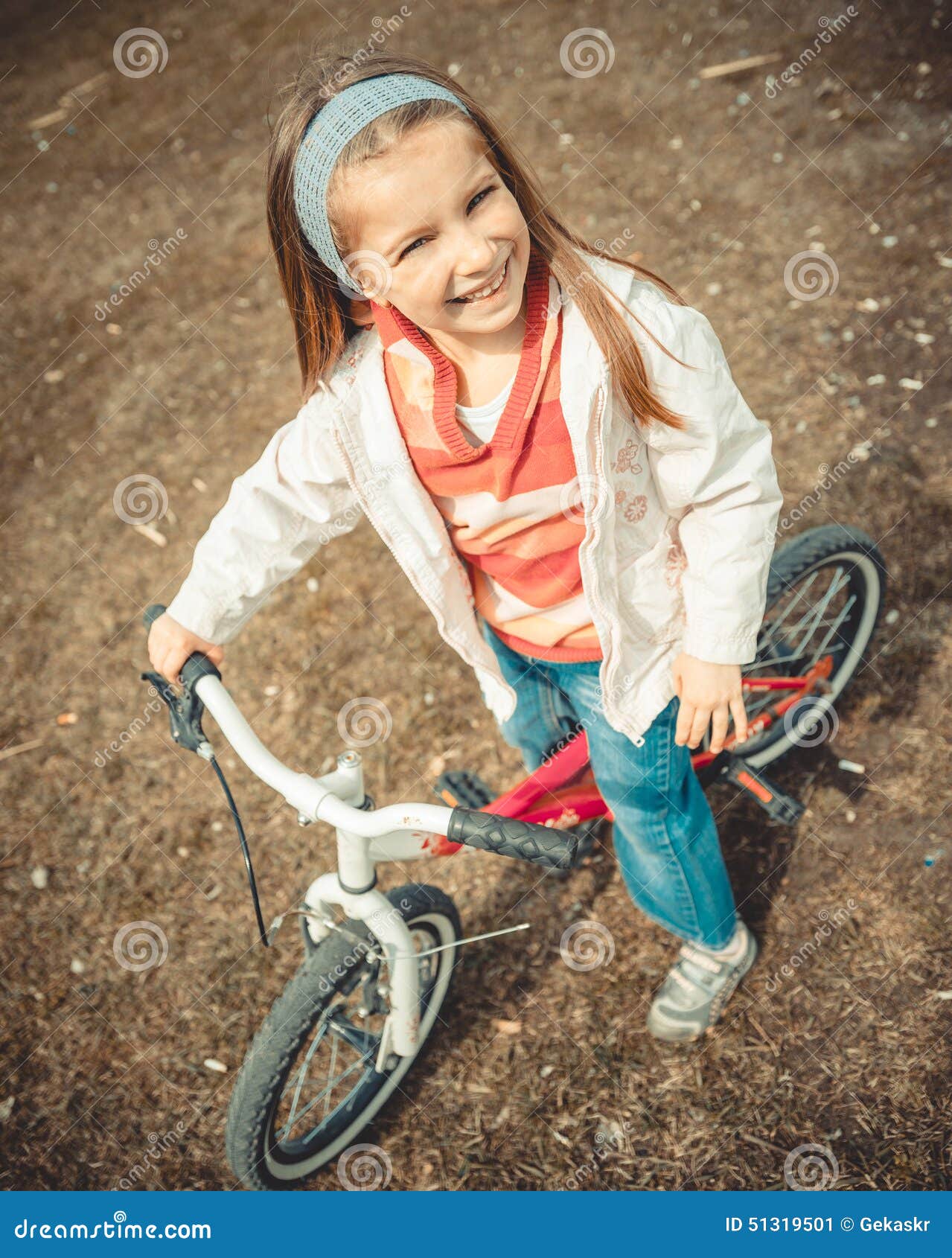 Little girl on a bicycle stock image. Image of happiness - 51319501