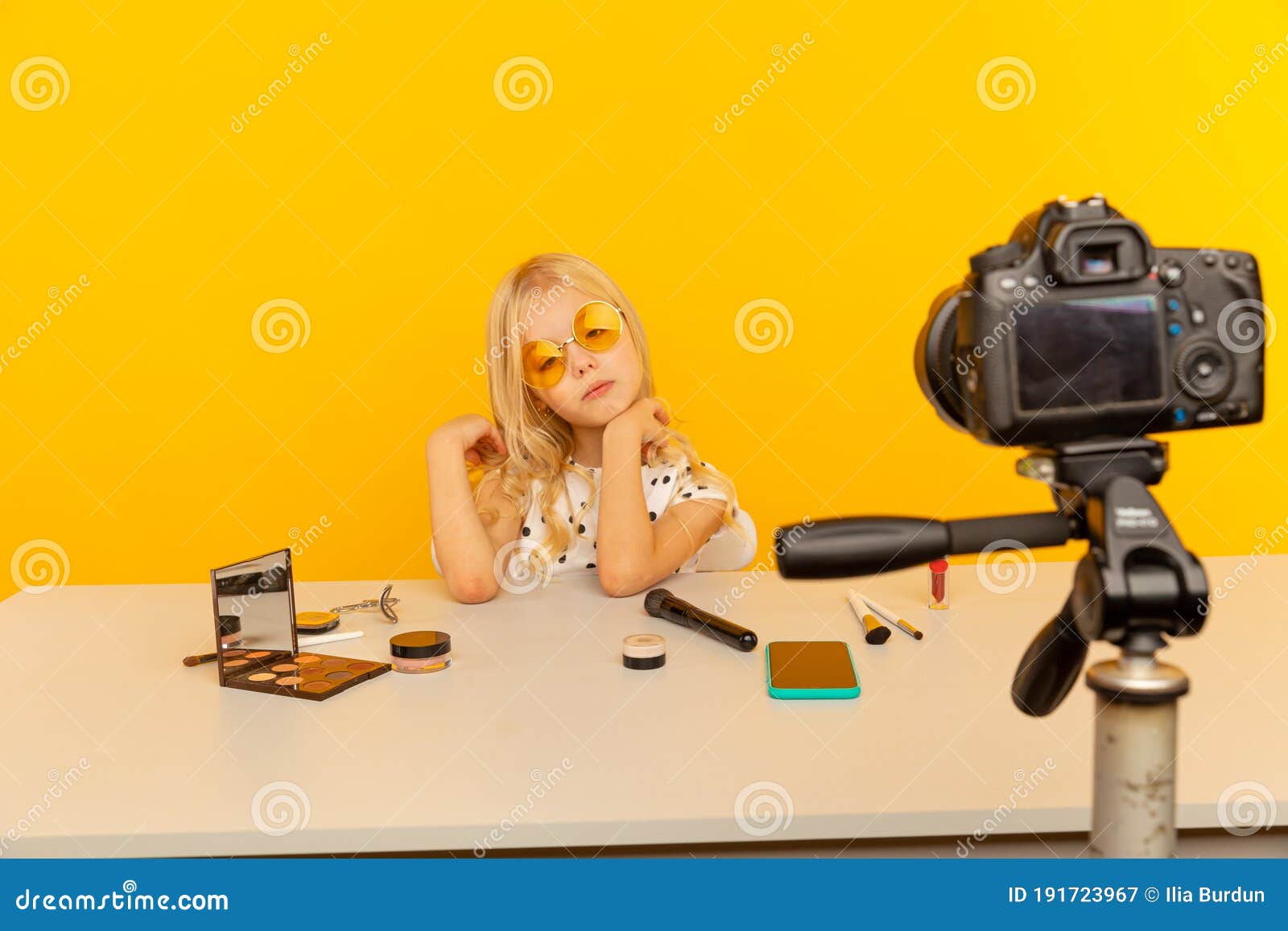 Little Girl Blogger in the Yellow Studio in Front of Camera Making ...