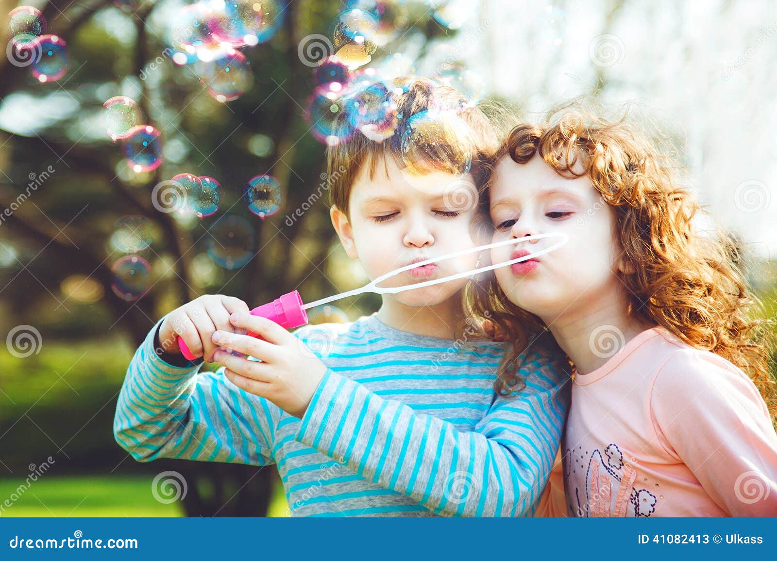 Little Girl and Boy Blowing Soap Bubble. Stock Image - Image of girl ... Little Girl and Boy Blowing Soap Bubble. Stock Image - Image of girl ...