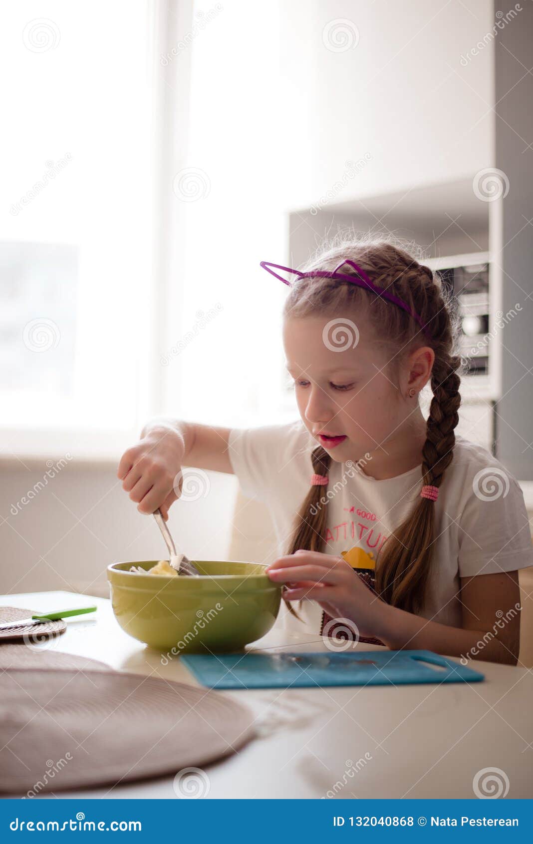 Little Girl with Braids is Cooking in the Kitchen Stock Photo - Image ...