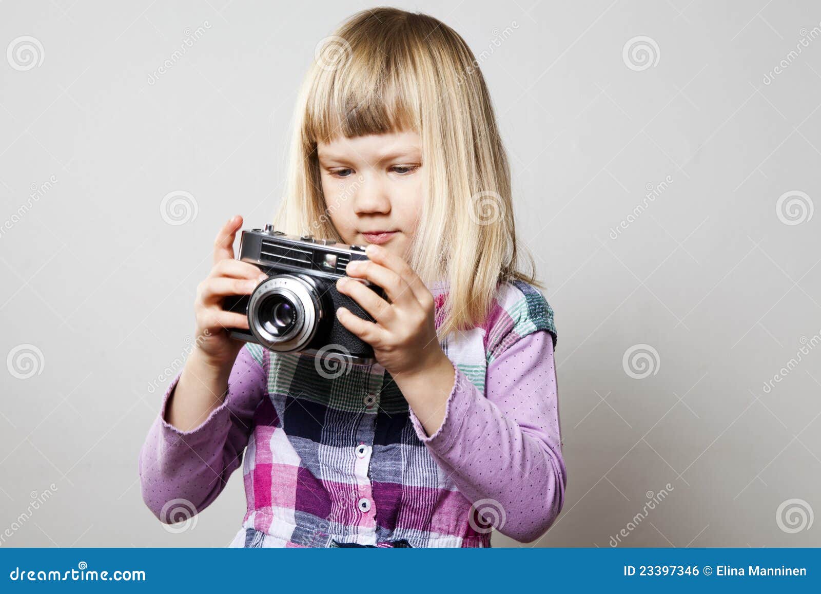 Little girl with camera stock photo. Image of studio - 23397346