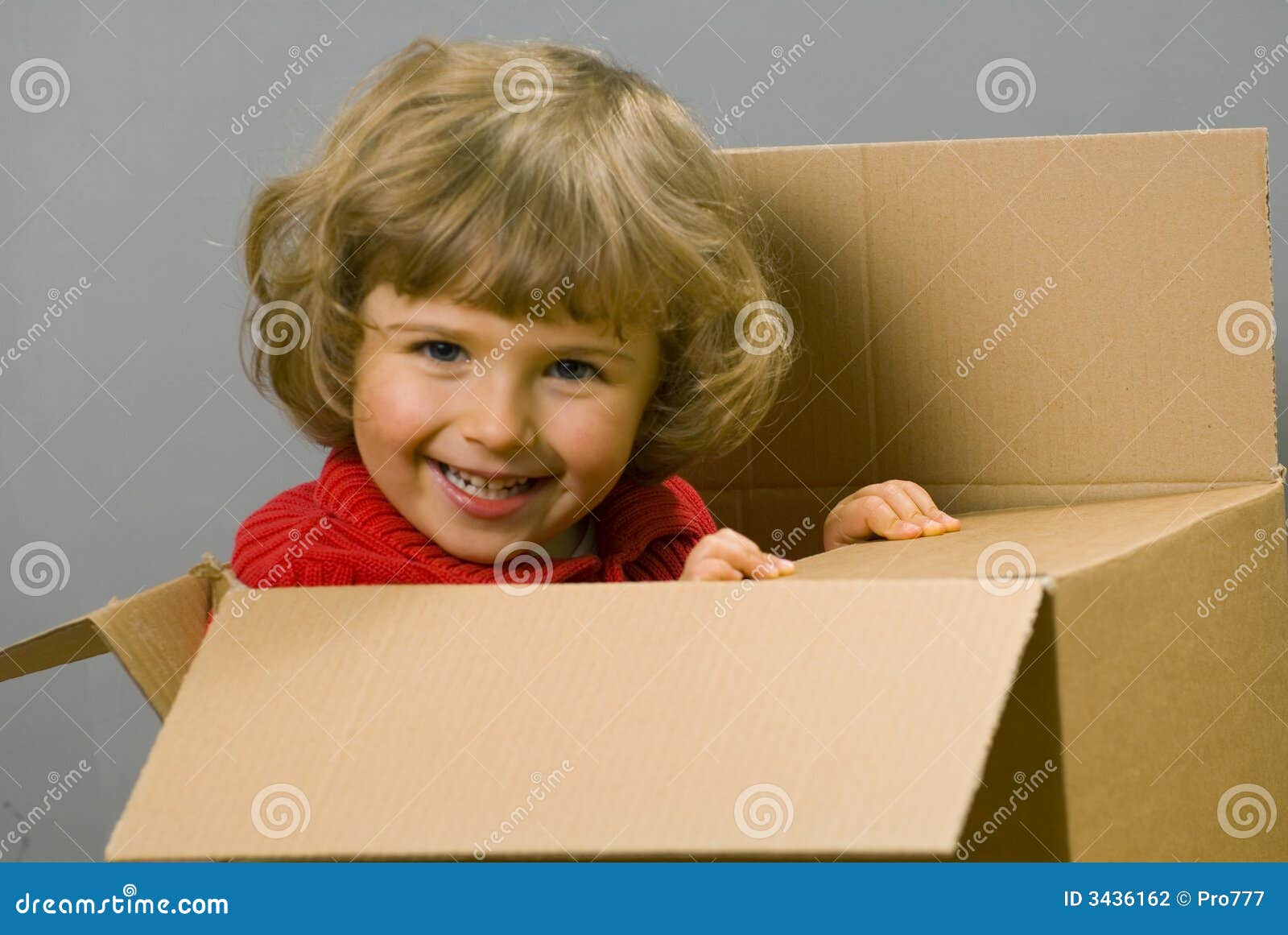 Little Girl with Cardboard Box Stock Photo - Image of casual ...