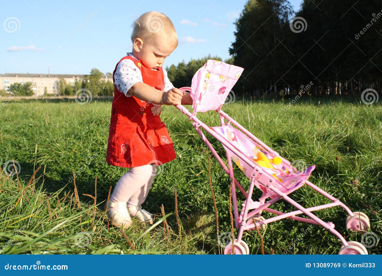 The Little Girl with a Carriage. Stock Image - Image of walk, clothes ...