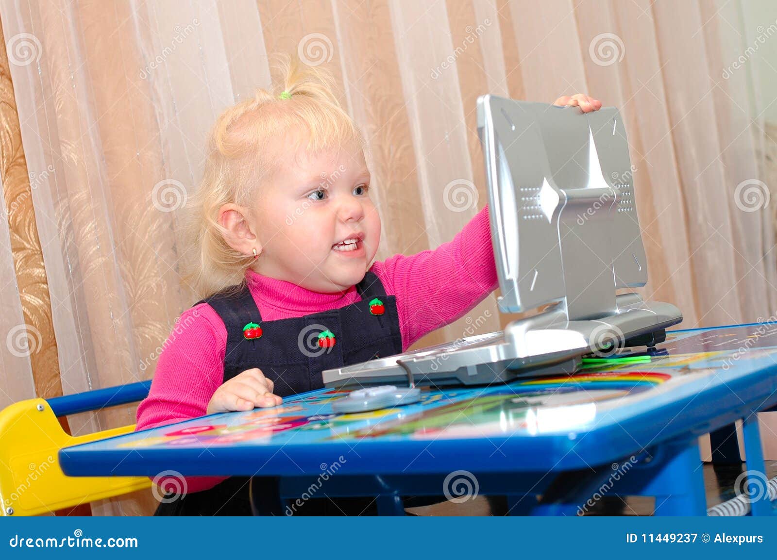 Little Girl with Child S Computer (notebook). Stock Image - Image of ...