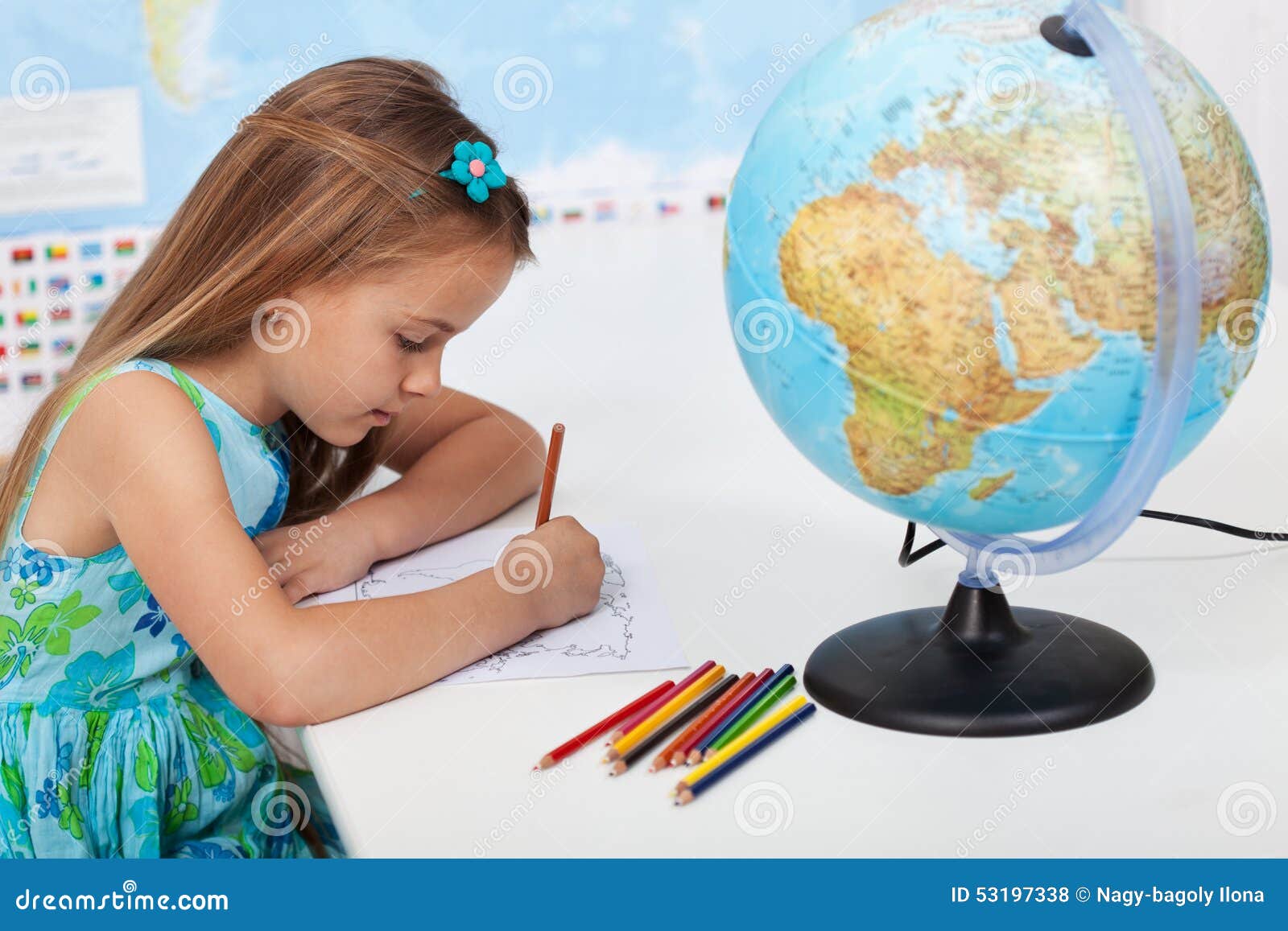 Little Girl Coloring the World Map in Geography Class Stock Photo ...