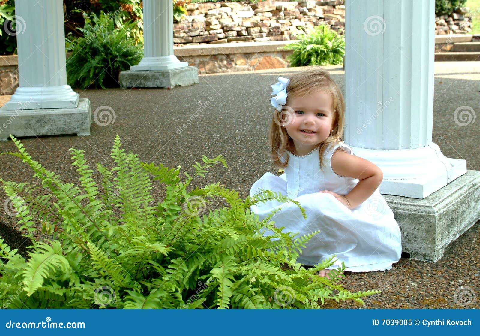 Little Girl by the columns stock image. Image of sitting - 7039005