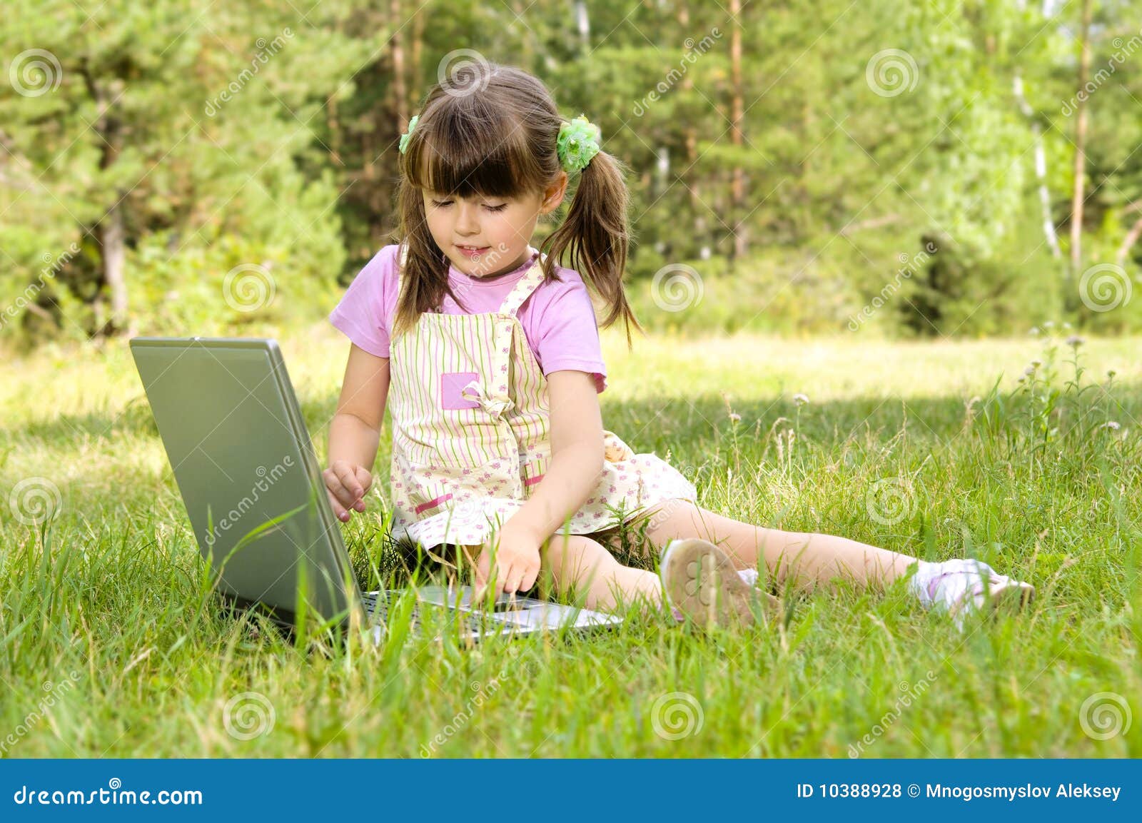 Little girl with computer stock photo. Image of mood - 10388928