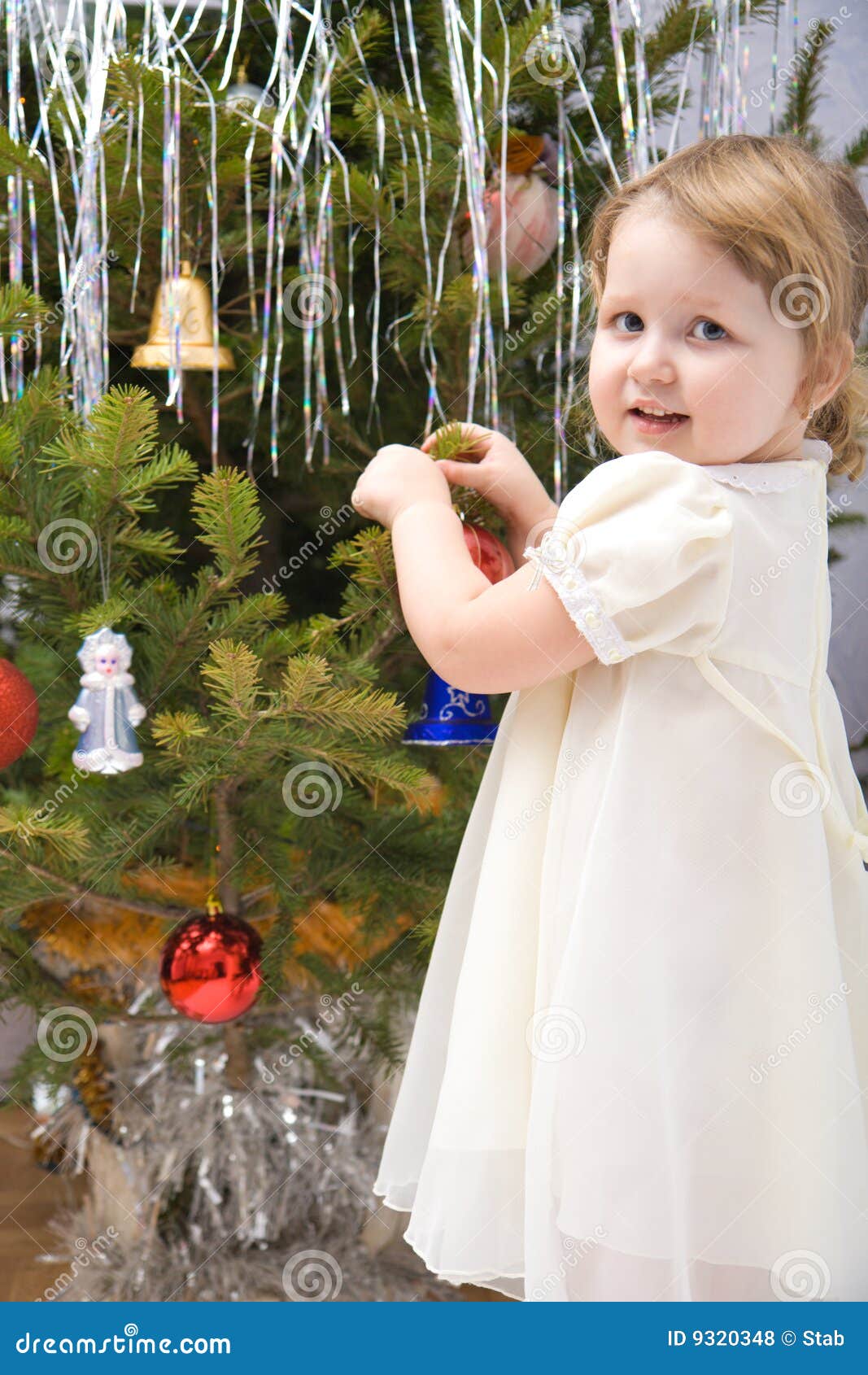 Little Girl is Decorating Christmas Tree Stock Photo - Image of ...