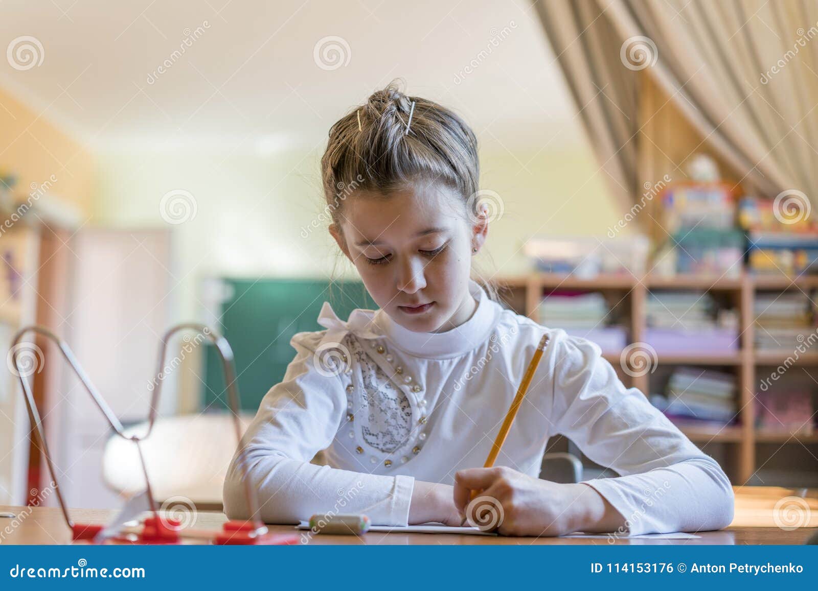 Little Girl at the Desk is Writing Stock Photo - Image of indoors ...