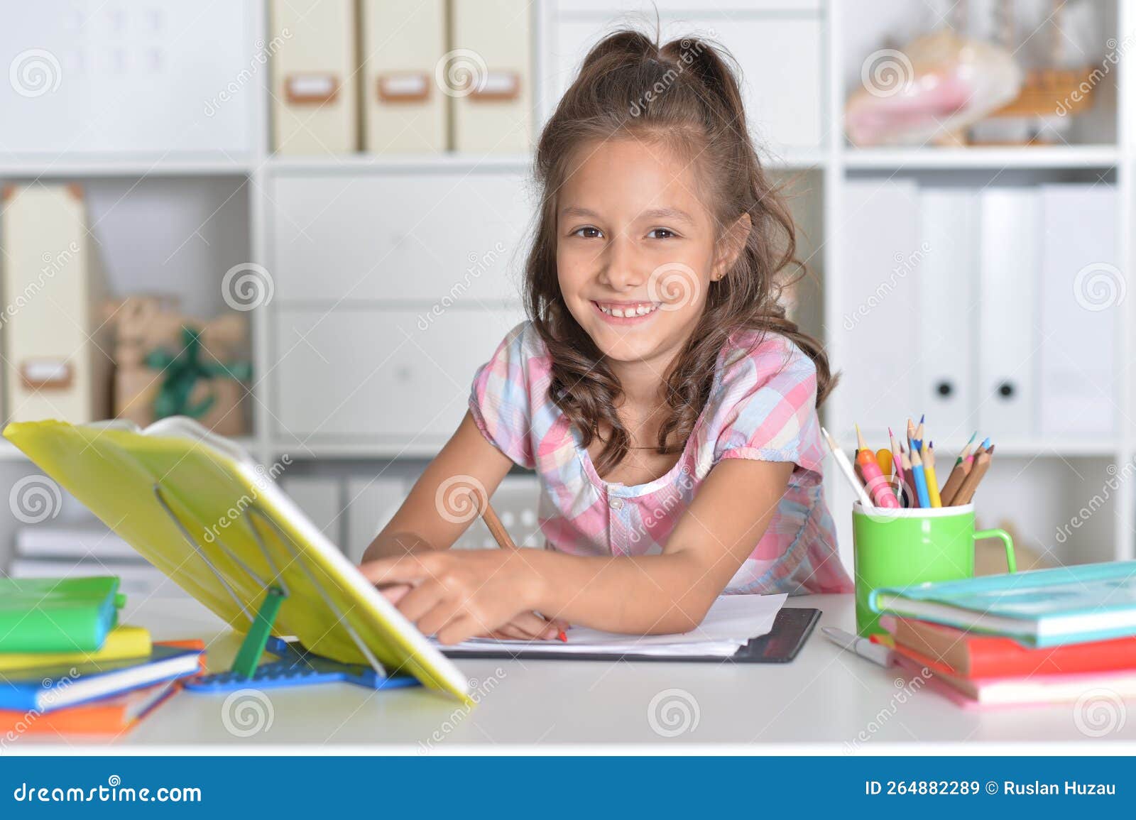 Little Girl Does Her Homework at the Table at Home Stock Image - Image ...
