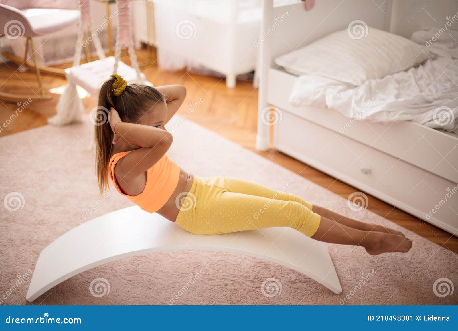 Little Girl Doing Crunches at Home. Stock Image - Image of meditation ...