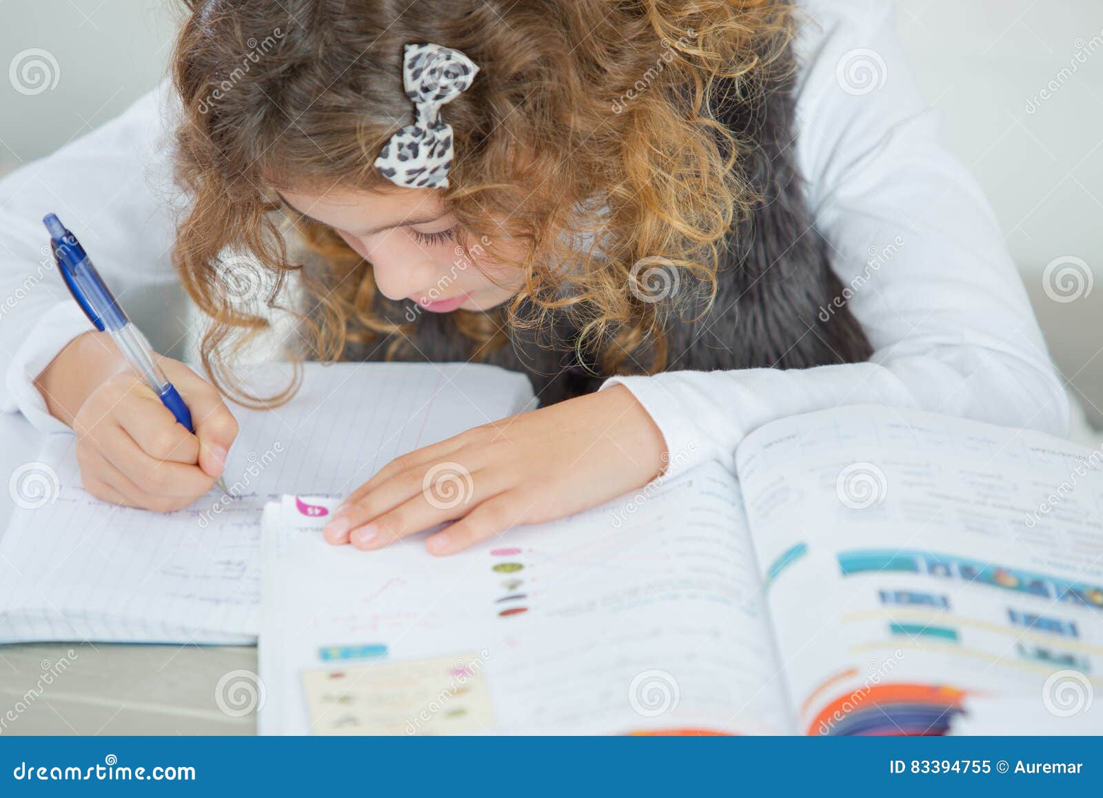 Little girl doing homework stock image. Image of child - 83394755
