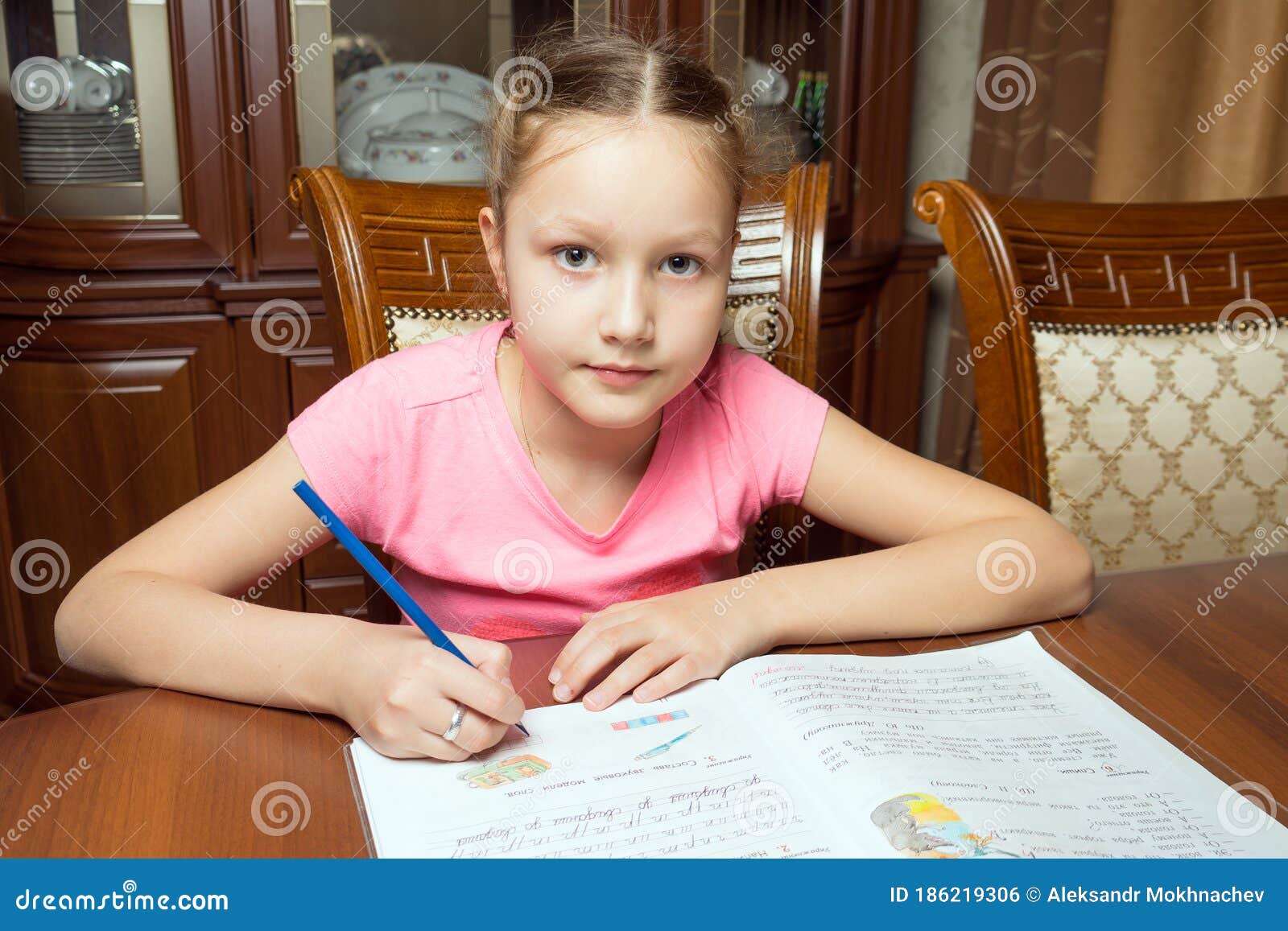 Little Girl Doing Homework at the Table Stock Photo - Image of person ...
