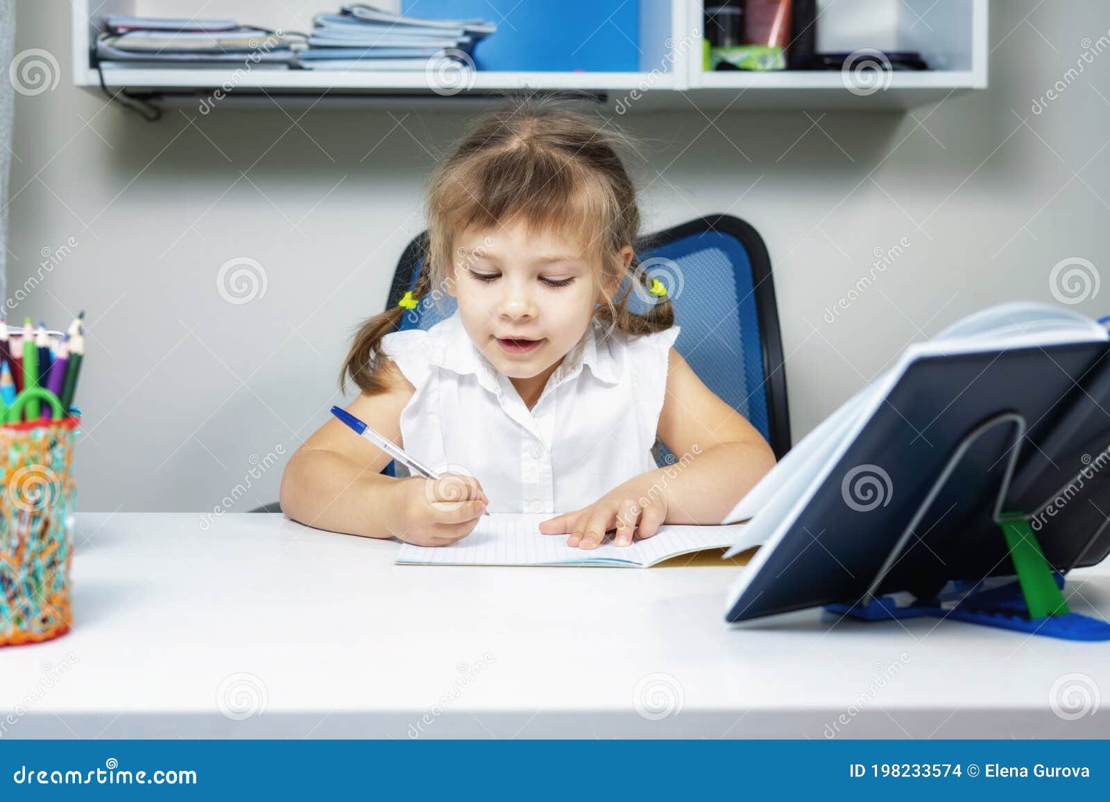 Little Girl Doing Homework at the Table Stock Photo - Image of cheerful ...