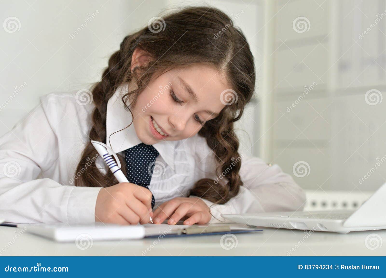 Little girl doing homework stock photo. Image of girl - 83794234