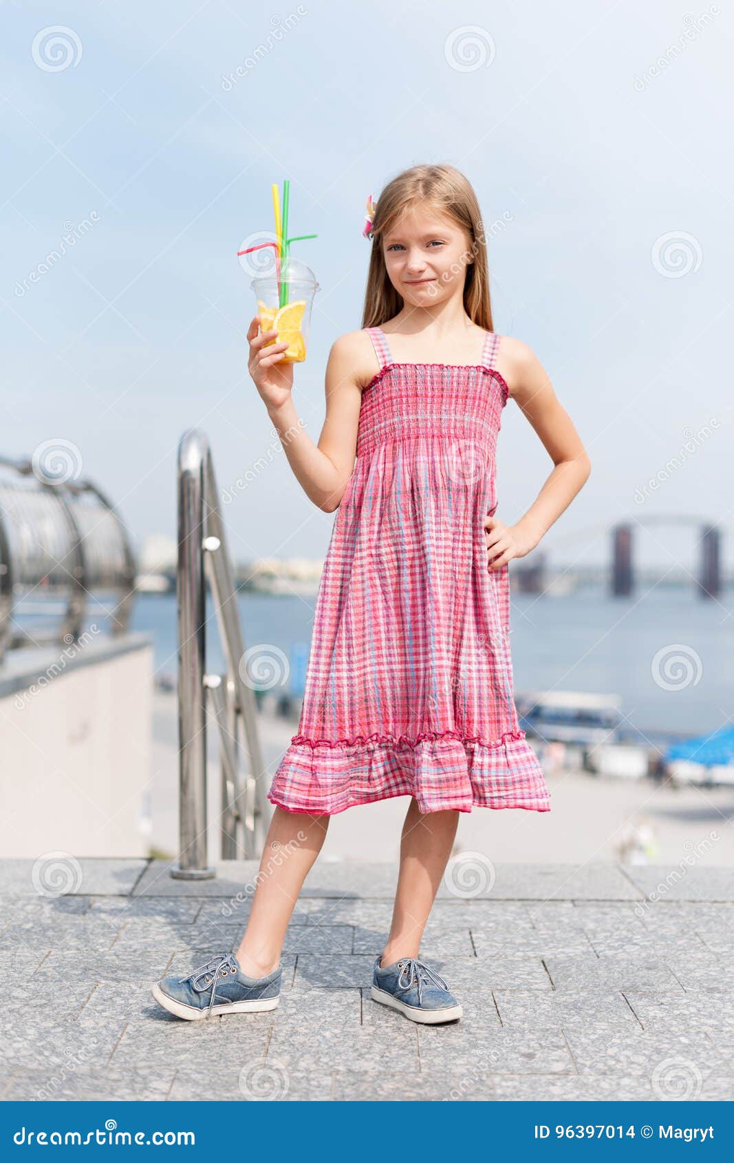 Little Girl Drinking Fruit Cocktail Outdoors in the Summer Day. Stock ...